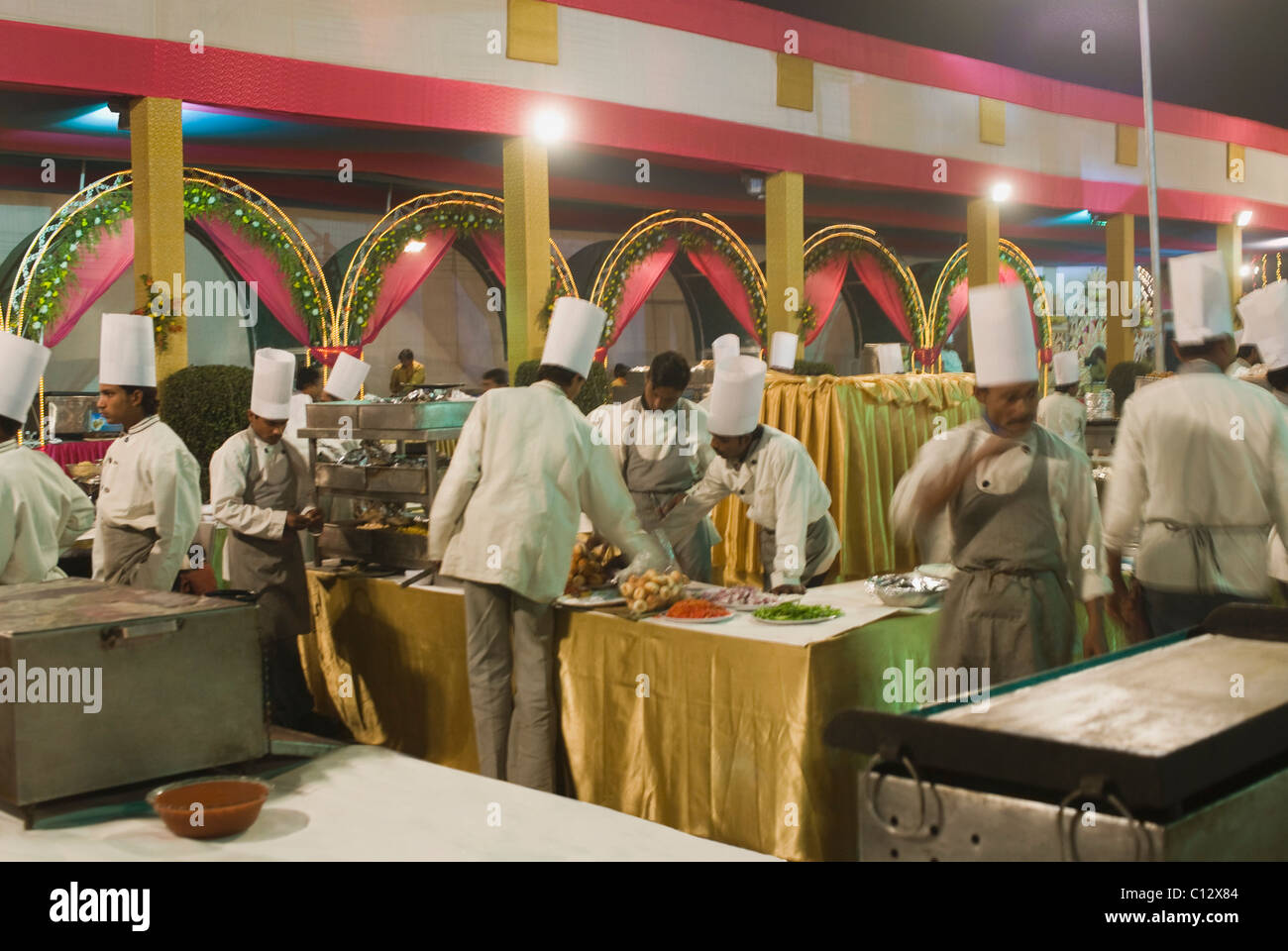 Chefs preparing food for a wedding feast in a tent Stock Photo - Alamy