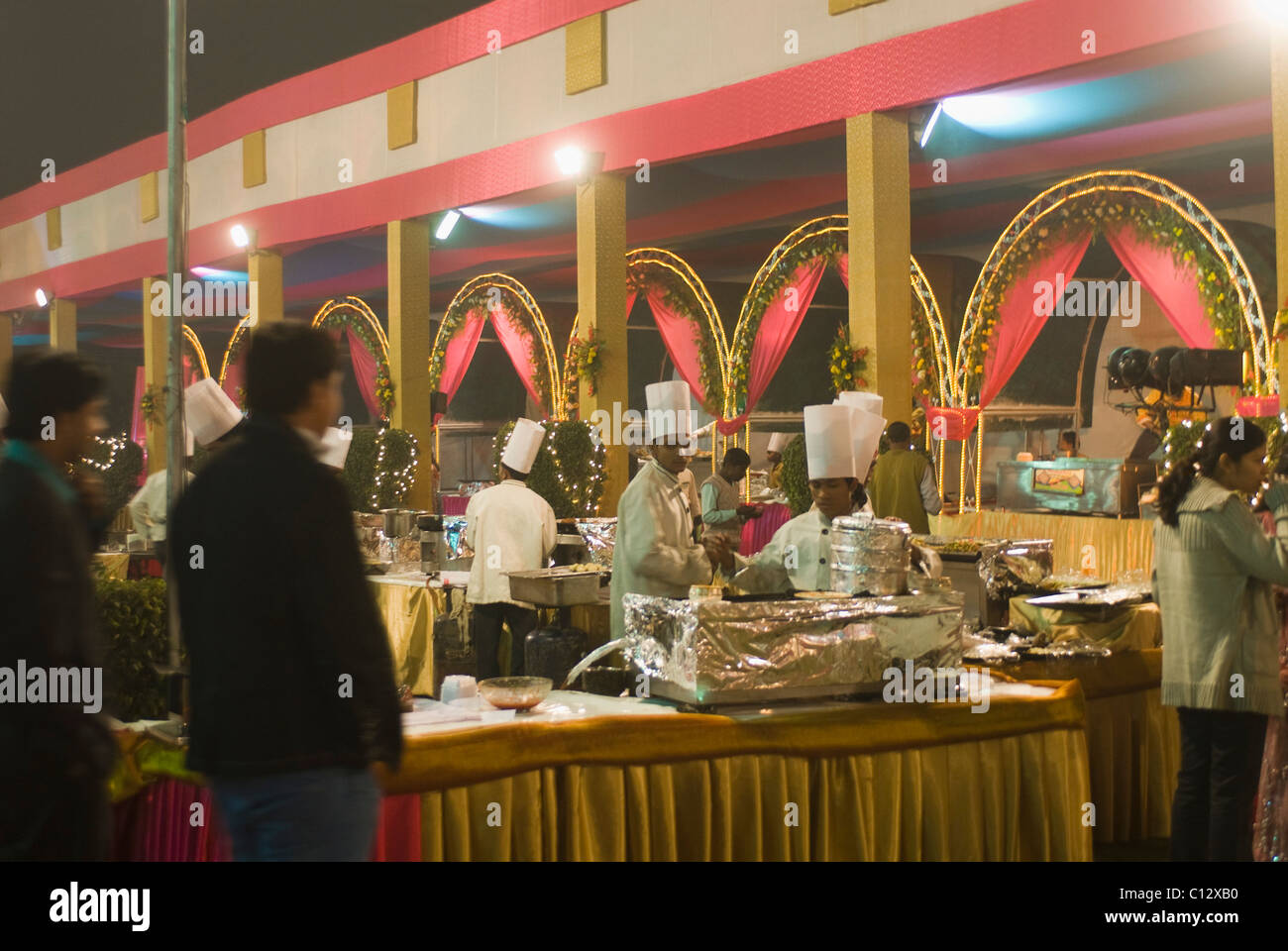 Chefs serving food in a wedding Stock Photo - Alamy