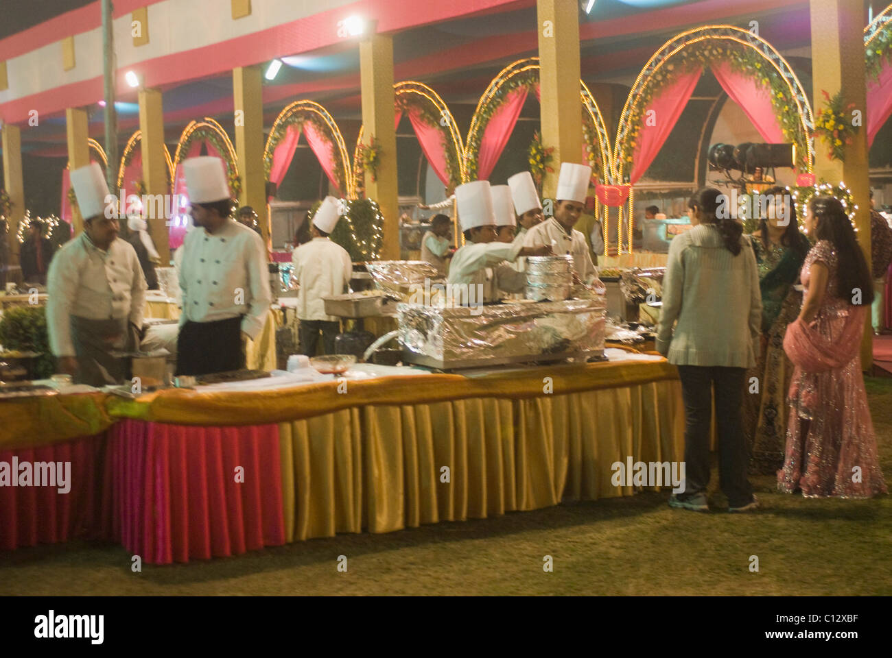 Chefs serving food in a wedding Stock Photo - Alamy