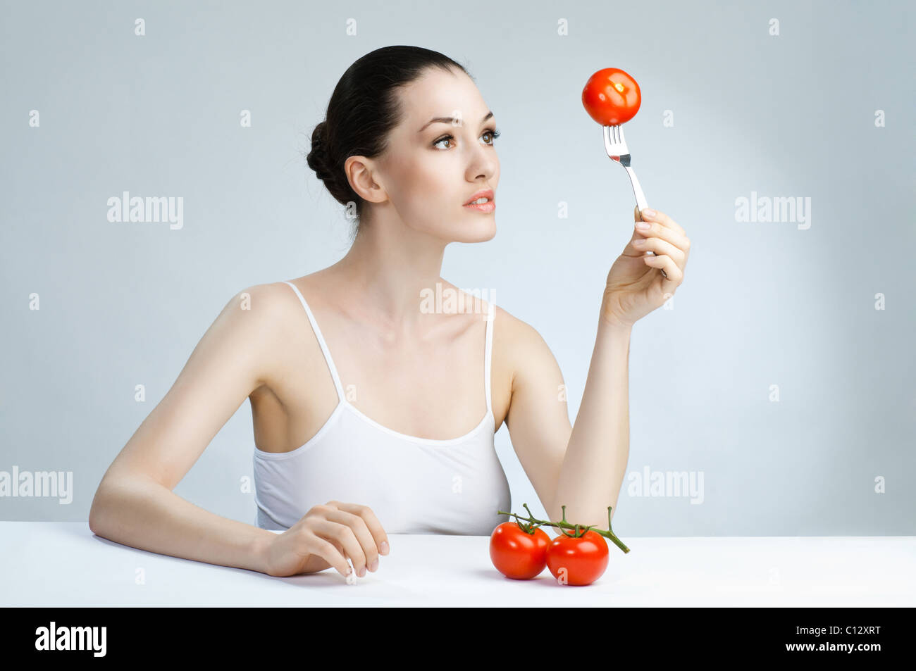 A beautiful slender girl eating healthy food Stock Photo - Alamy