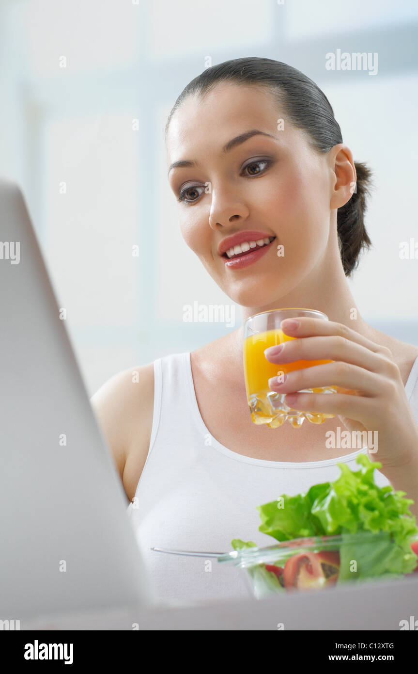 A beautiful slender girl eating healthy food Stock Photo - Alamy