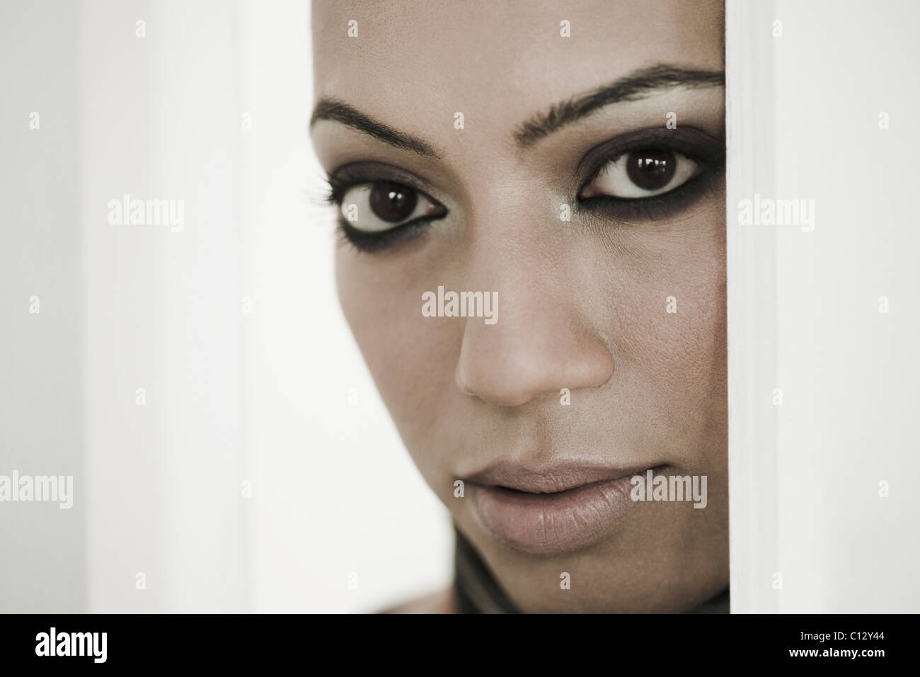 Gay man peeking from a window Stock Photo - Alamy