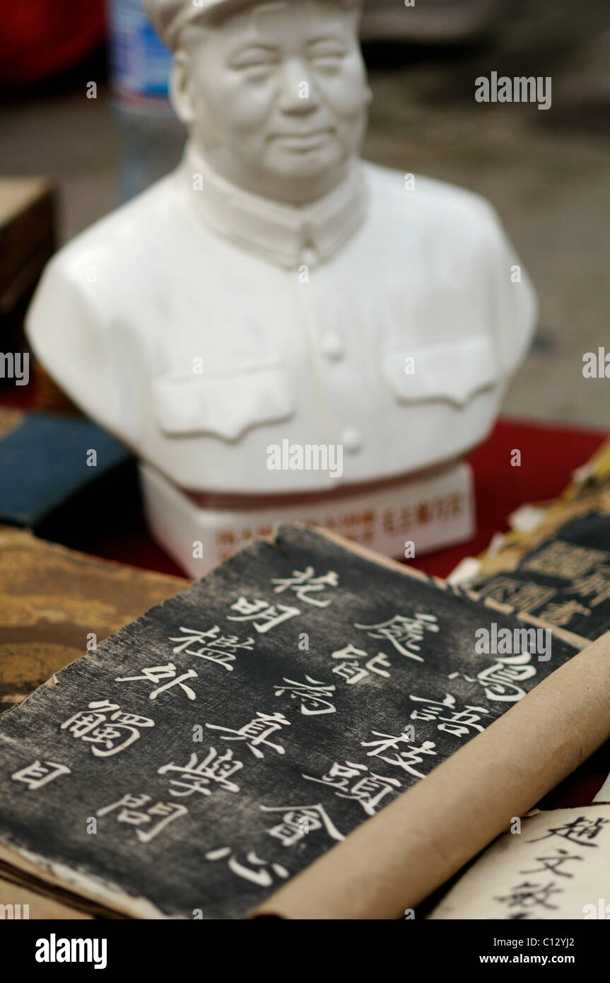 chinese book with sculpture of former chinese leader Mao Zedong in ...