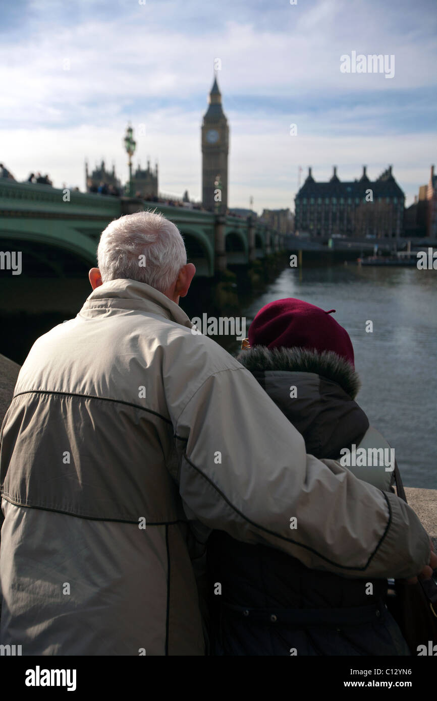a couple embrace at westminster bridge in london Stock Photo - Alamy