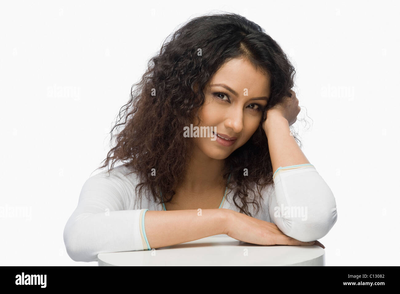 Portrait of a woman leaning on a stool Stock Photo - Alamy