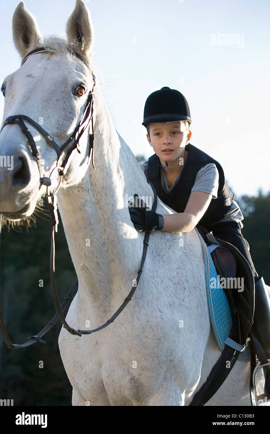 Boy on white horse hi-res stock photography and images - Alamy