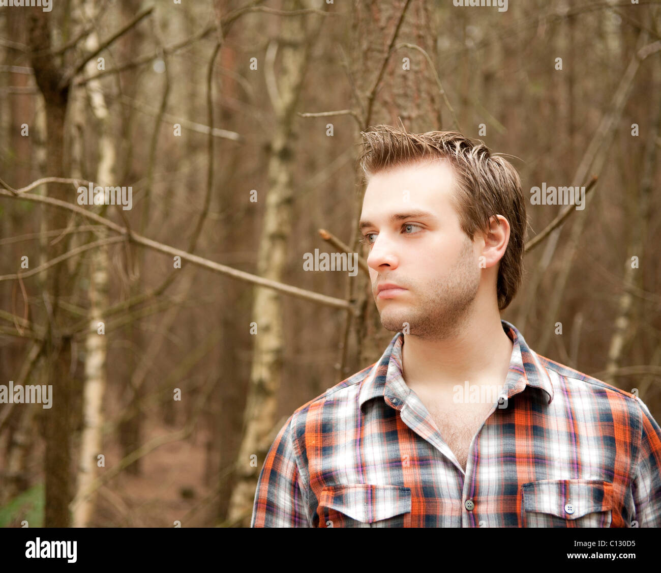 portrait of young man in forest Stock Photo - Alamy