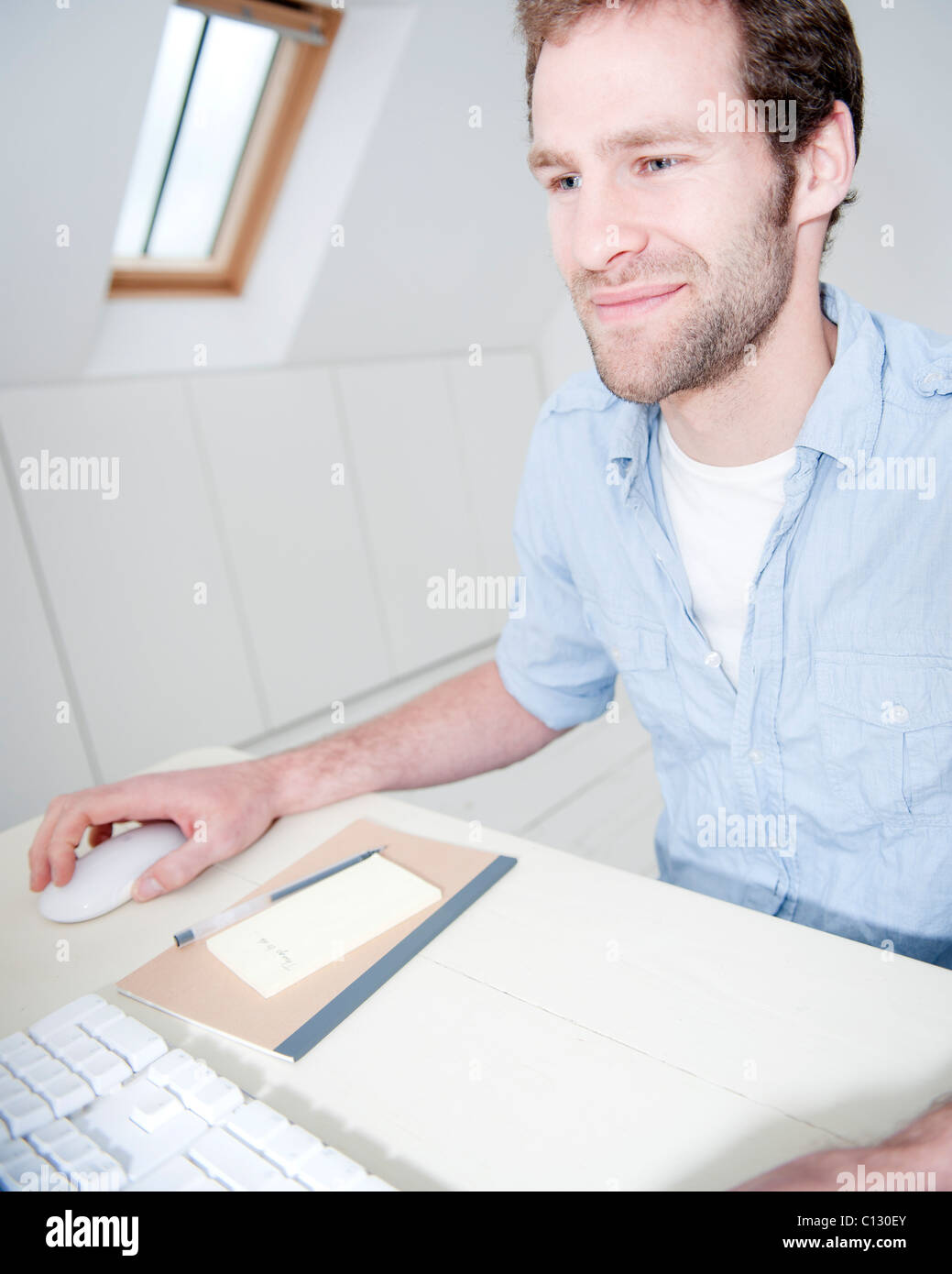 portrait of young man working with computer at home Stock Photo - Alamy
