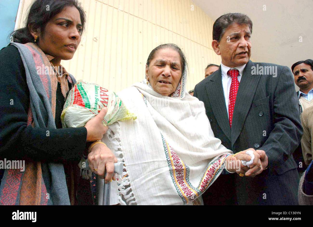 Martha Jacob (C), the mother of slain Federal Minister for Minorities ...
