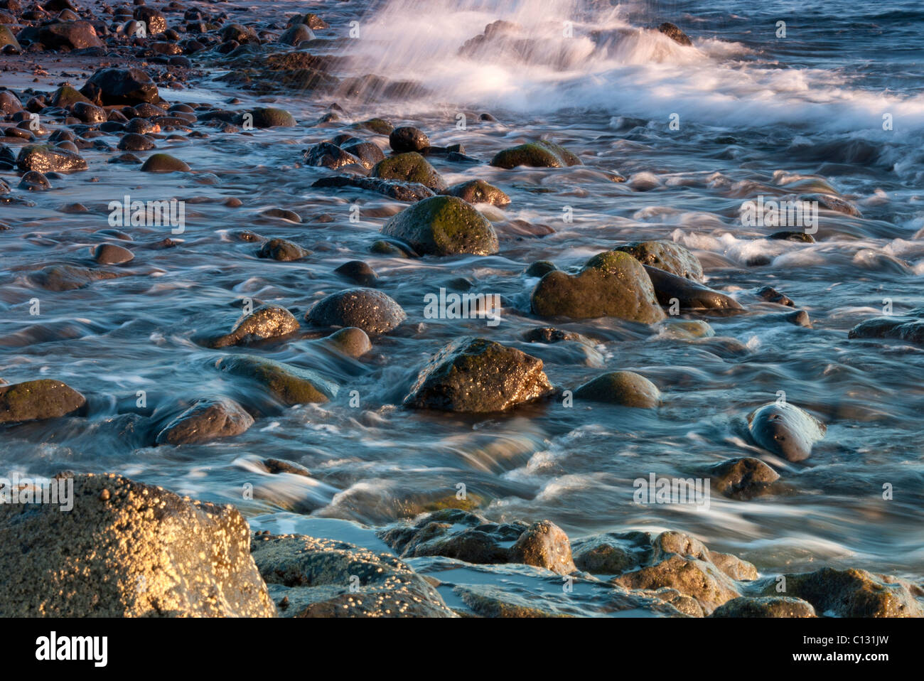 rippling water over the rocks Stock Photo - Alamy
