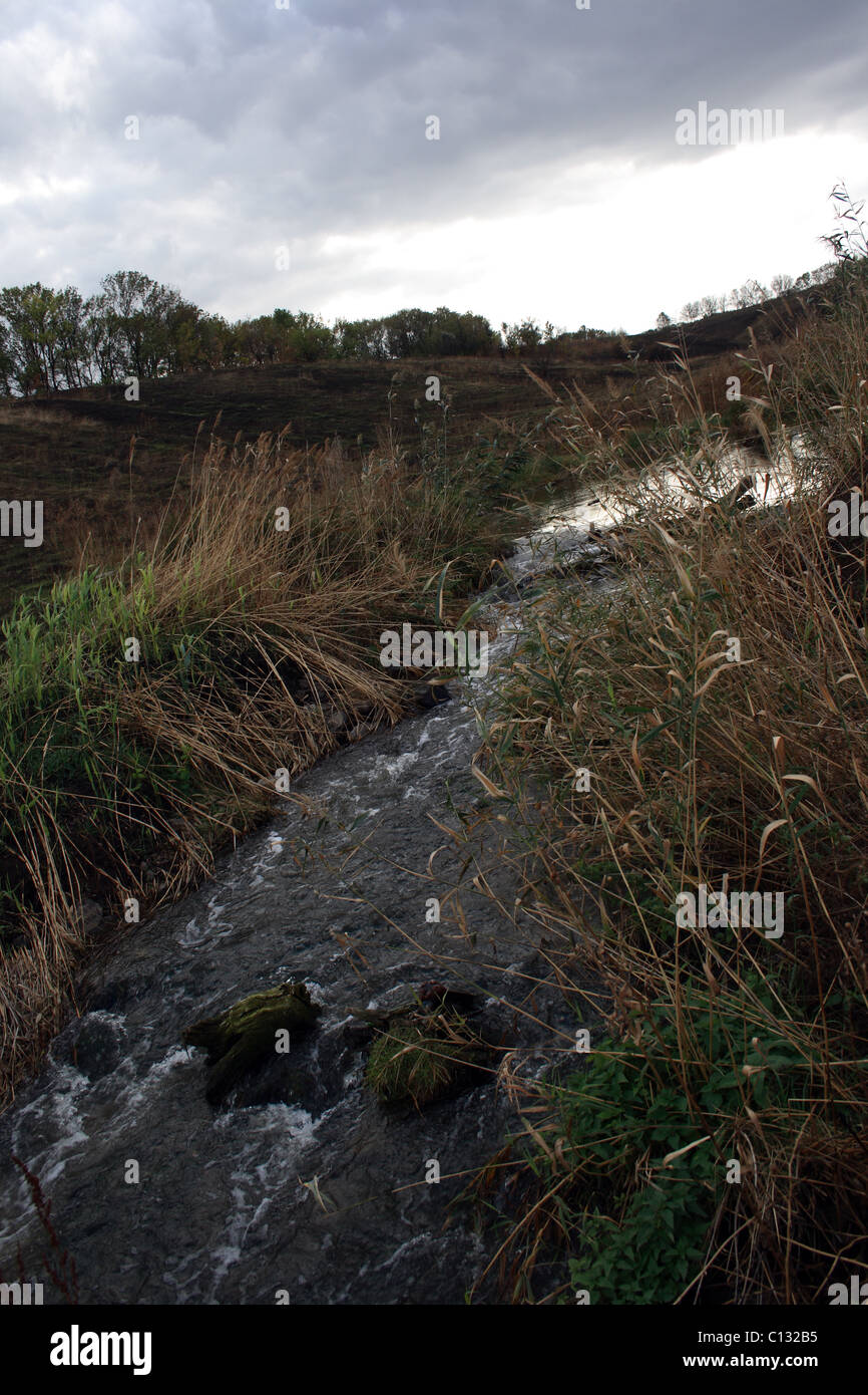 landscape with small river Stock Photo - Alamy