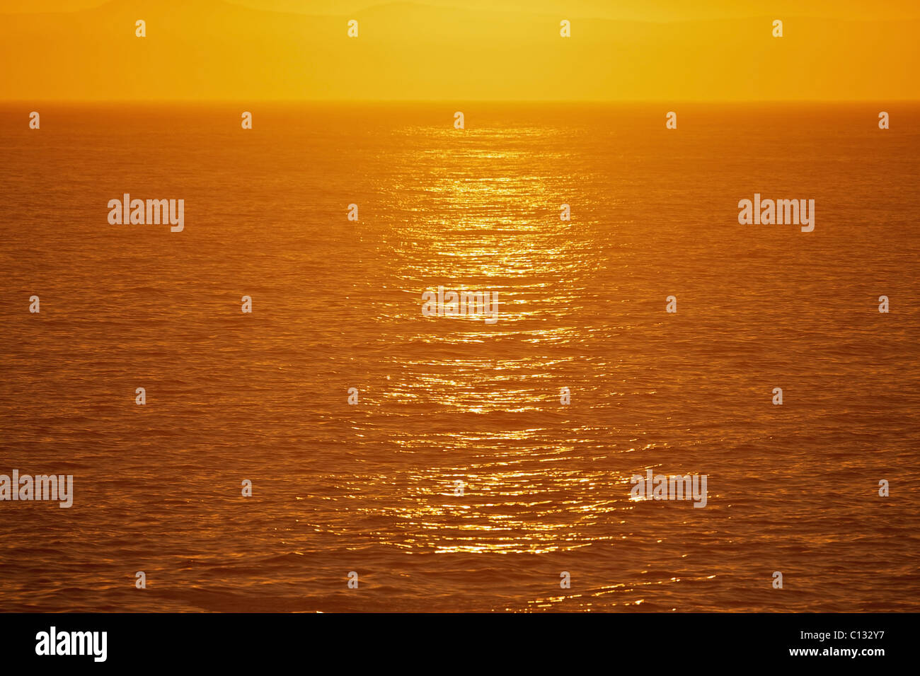 Late afternoon sun reflecting in sea, Kogel Bay, Western Cape Province ...