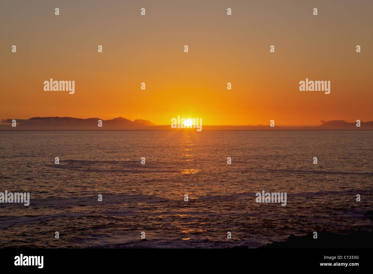 Late afternoon sun reflecting in sea, Kogel Bay, Western Cape Province ...