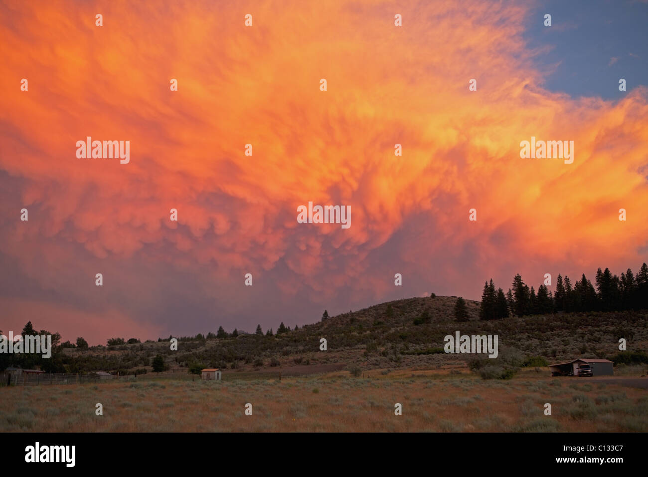 Sunset over the semi arid desert plains in the South Western part of ...
