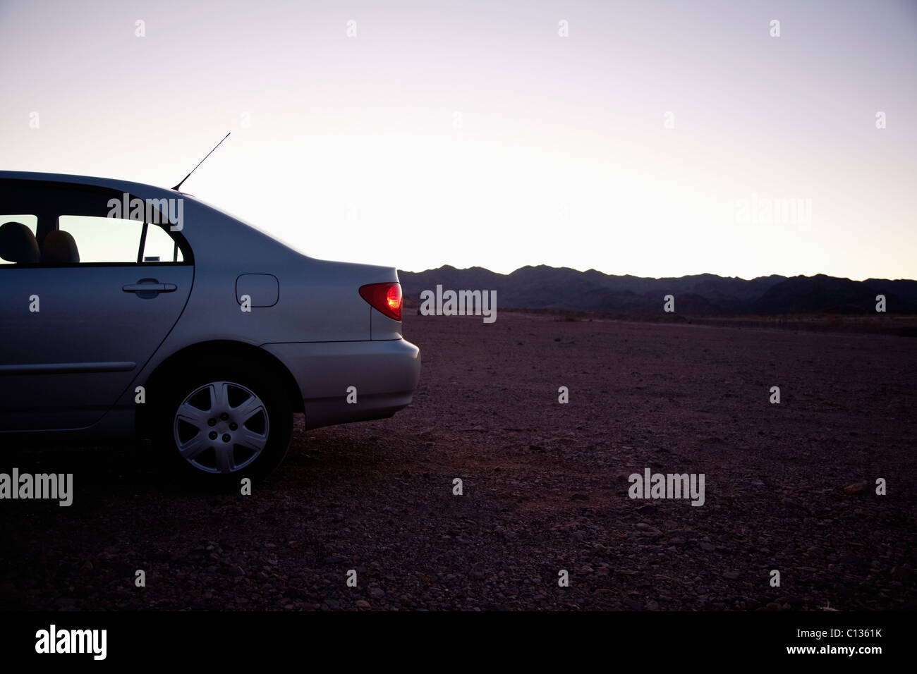 USA, Nevada, car on desert road at dusk Stock Photo - Alamy