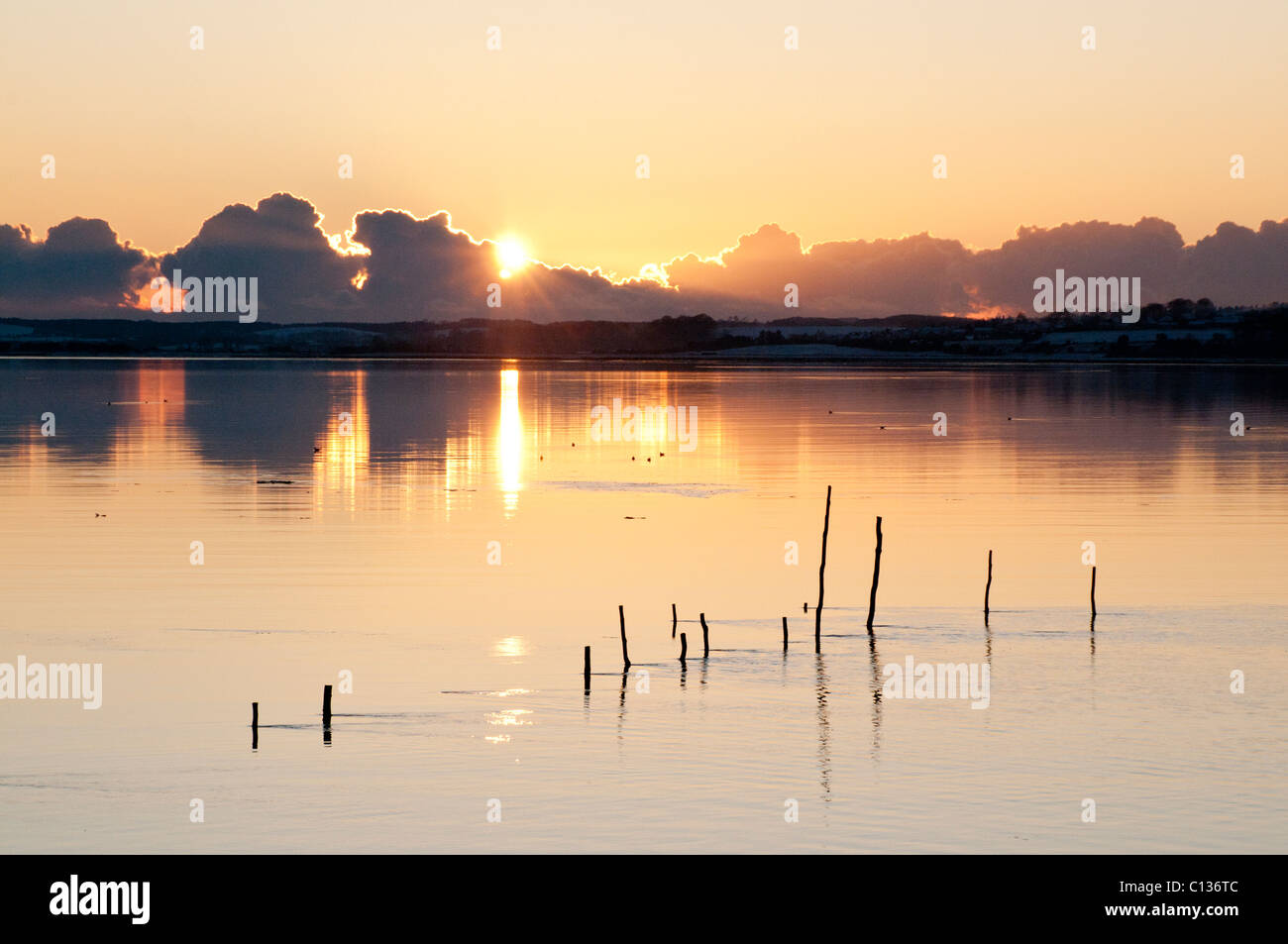 Sunset across Wigtown bay by Creetown with remnants of Salmon Stake ...