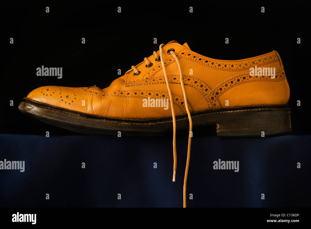 Traditional brogue on black background Stock Photo - Alamy