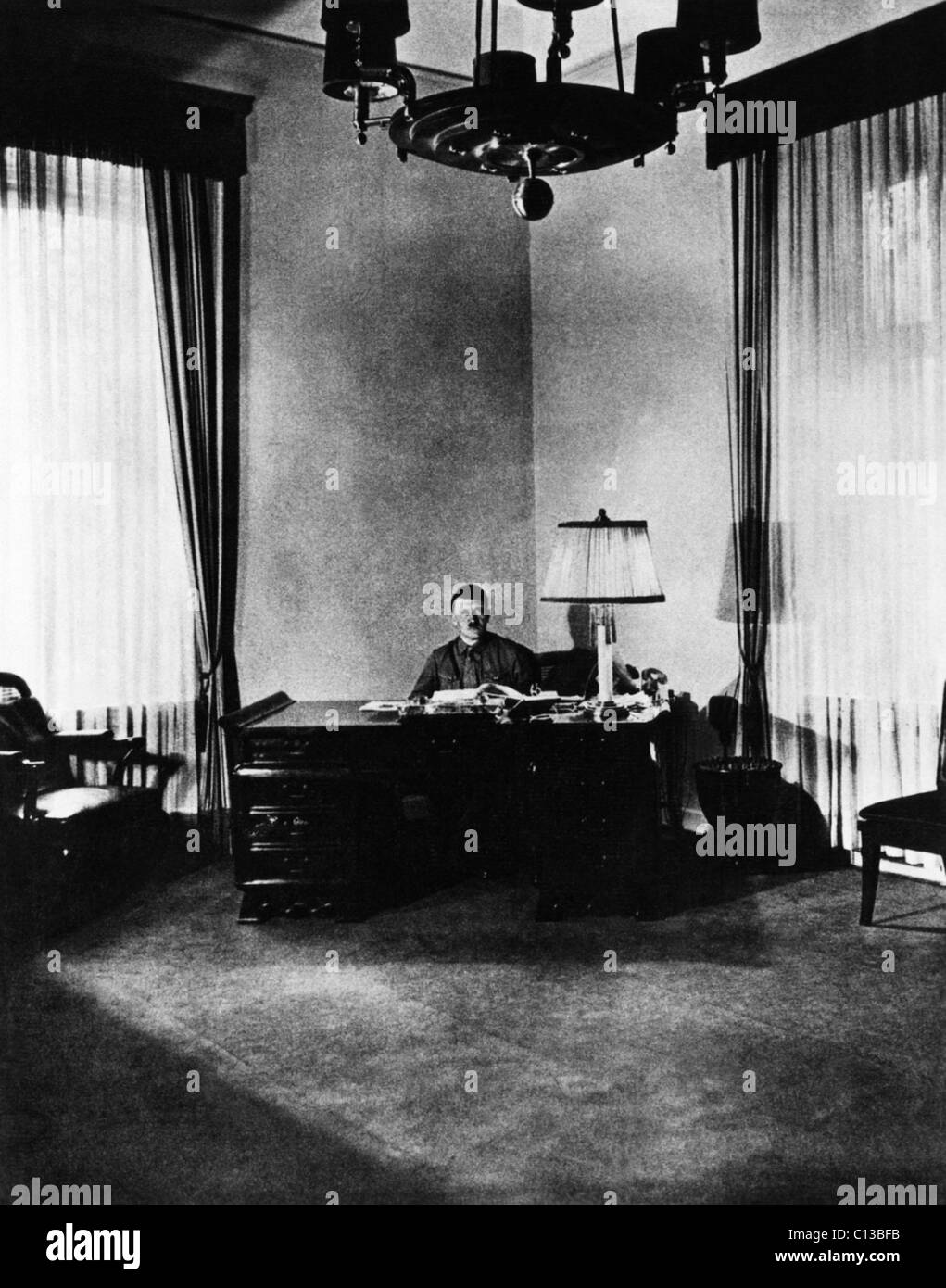 Adolf Hitler, in his office at the Braunes Haus, national headquarters ...