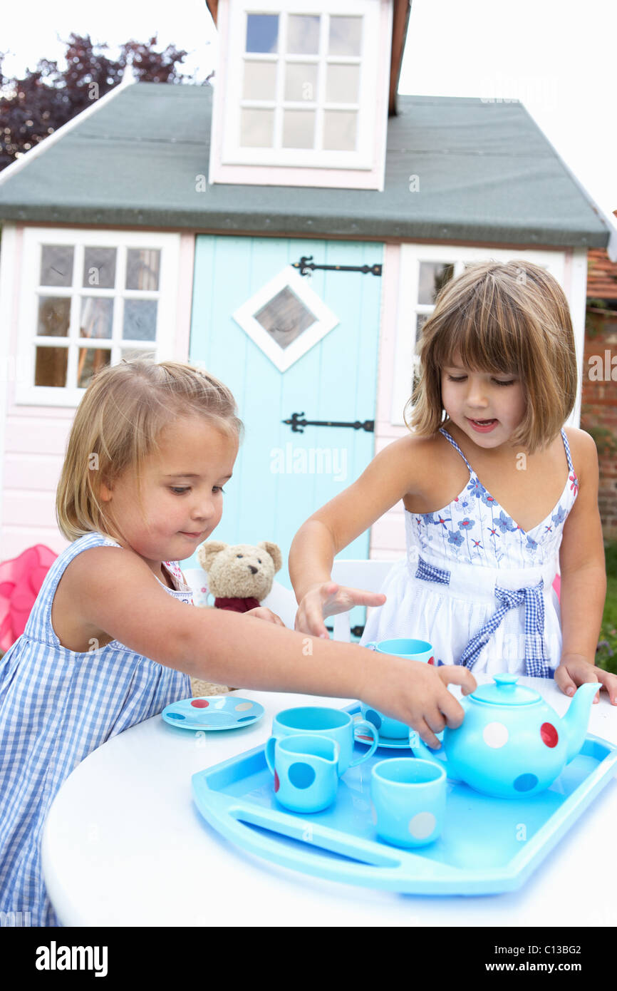 Two young girls play outdoors Stock Photo - Alamy