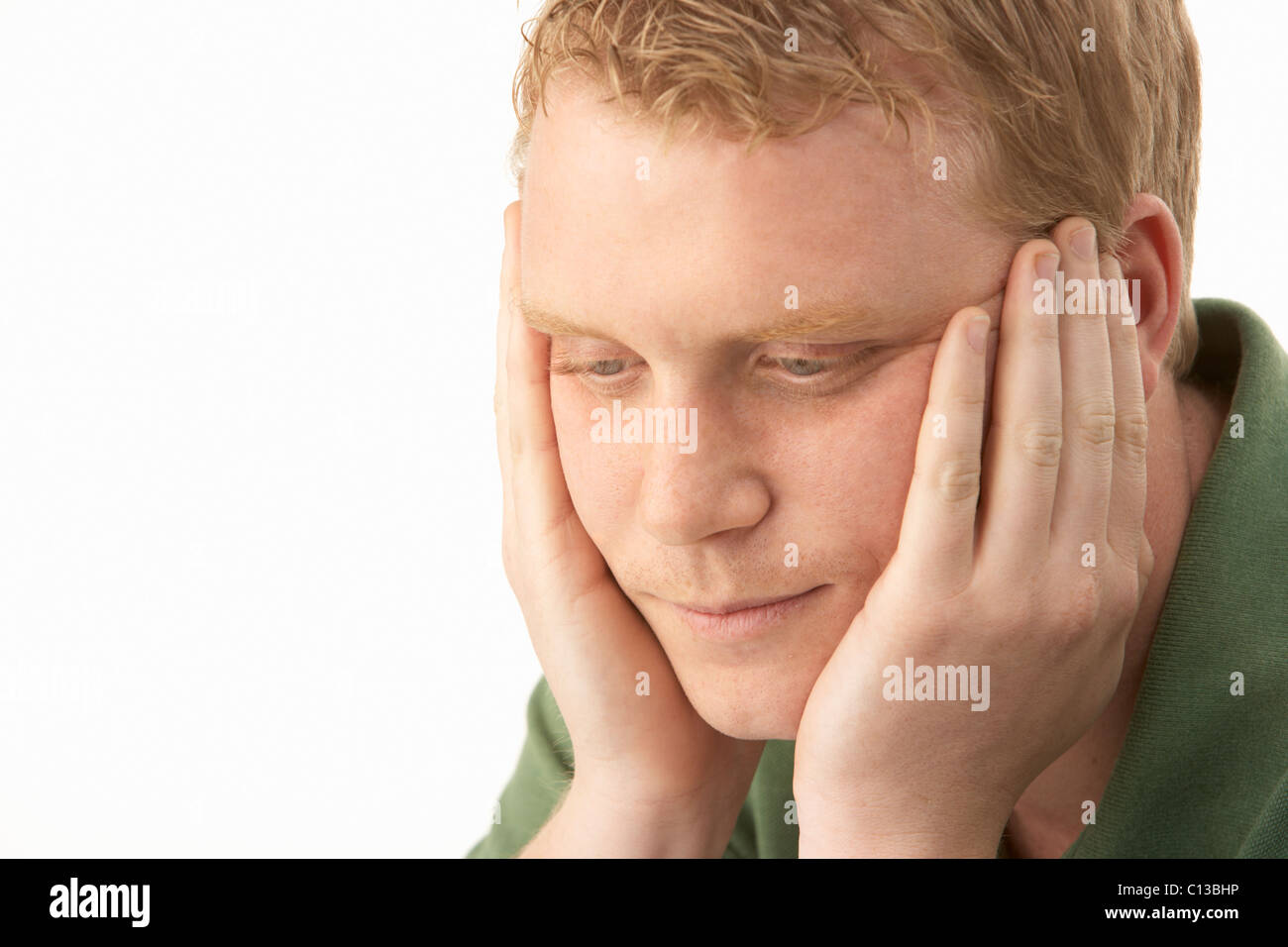 Young man deep in thought Stock Photo - Alamy