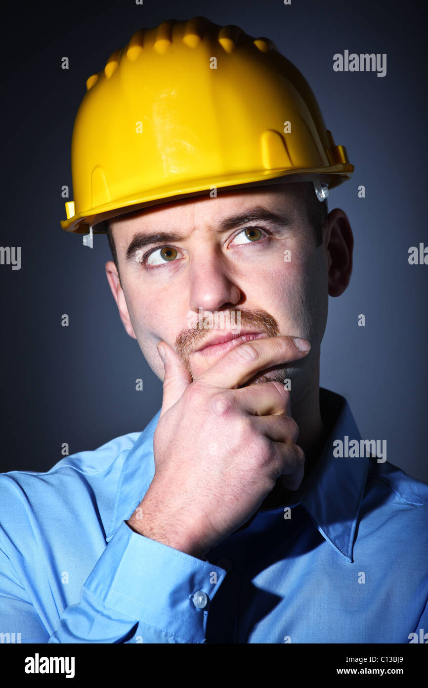 closeup image of caucasian thinking engineer portrait Stock Photo - Alamy