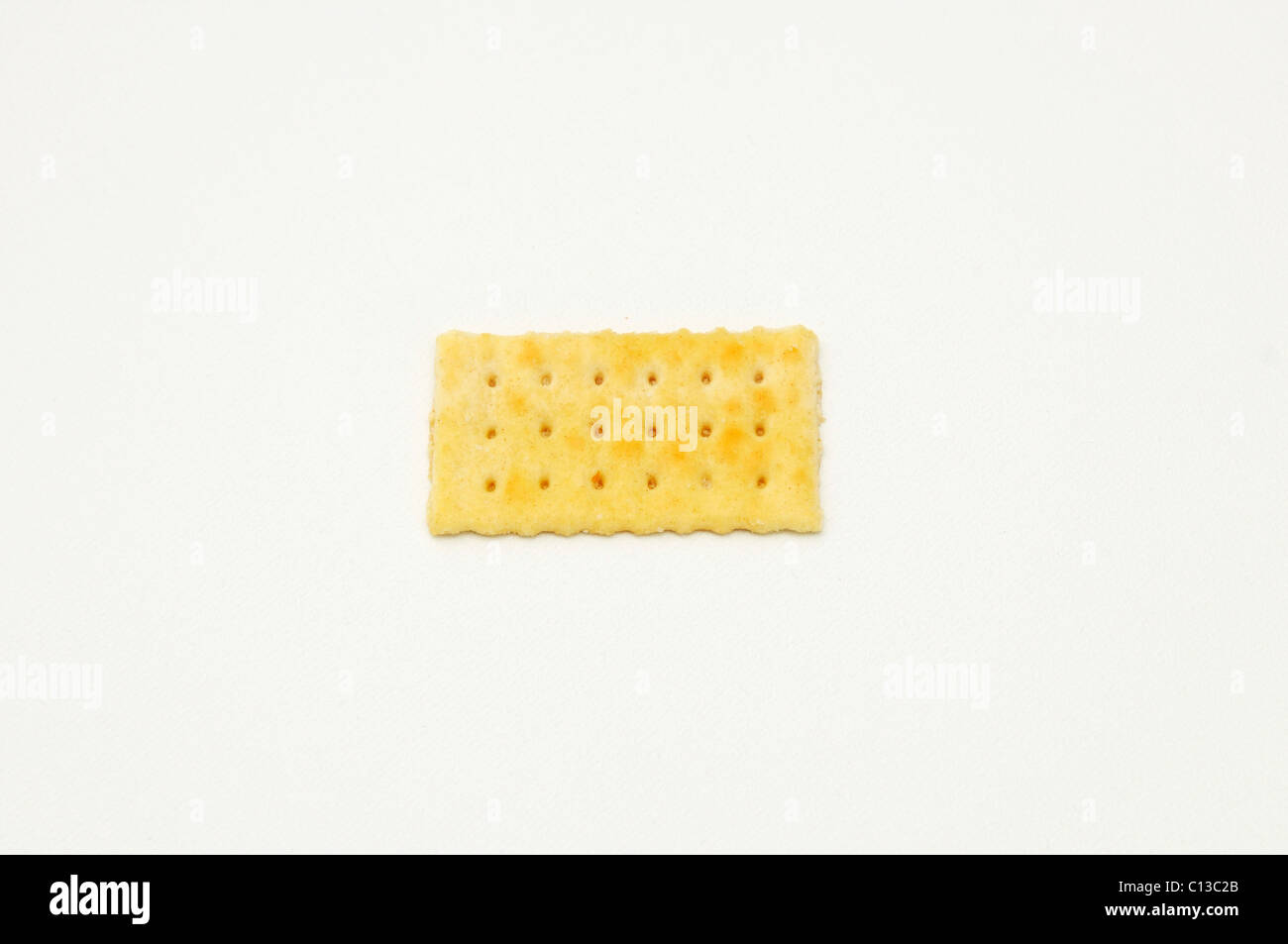 One yellow cracker with white background Stock Photo - Alamy