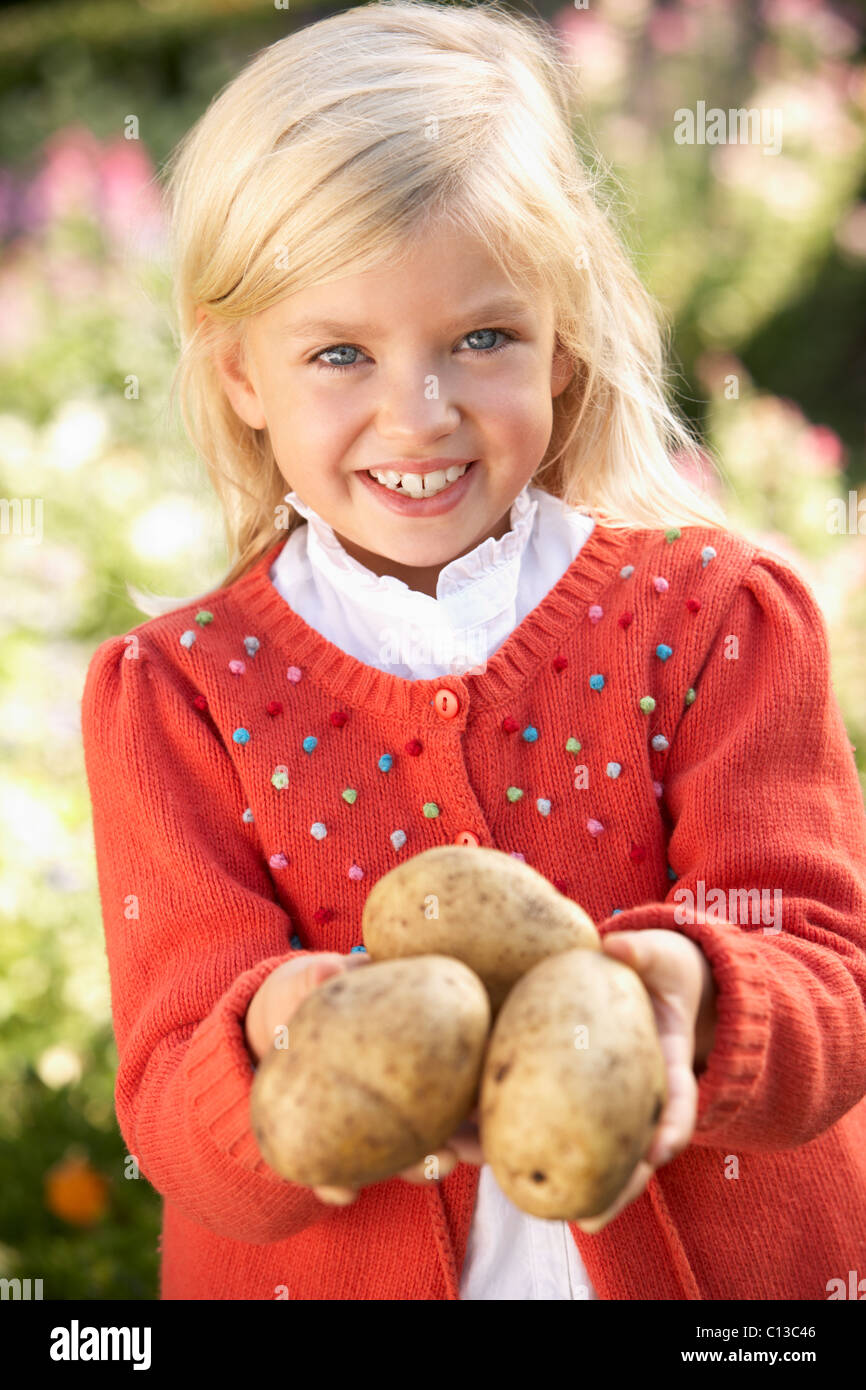 Child holding potato hi-res stock photography and images - Alamy