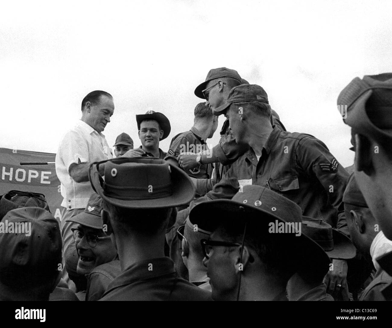 Bob Hope signing autographs for the troops in Vietnam, 1965 Stock Photo ...
