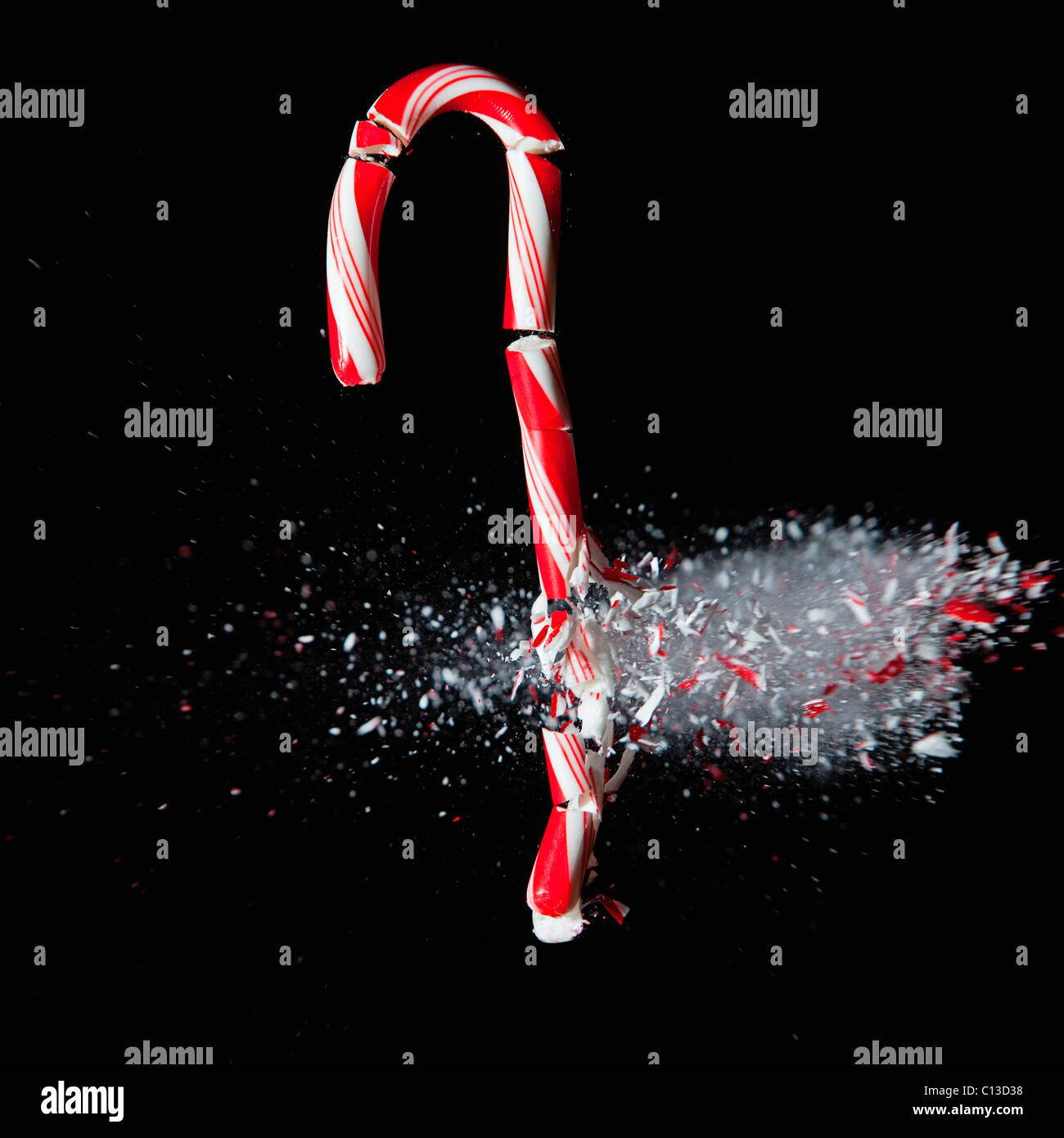 Studio Shot of candy cane crushed by bullet Stock Photo - Alamy