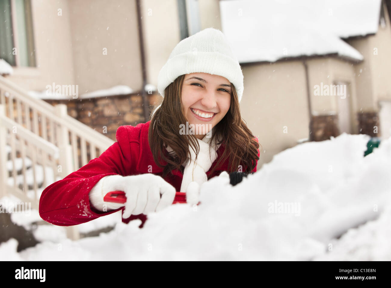 USA, Utah, Lehi, Portrait of young woman scraping snow from car Stock ...
