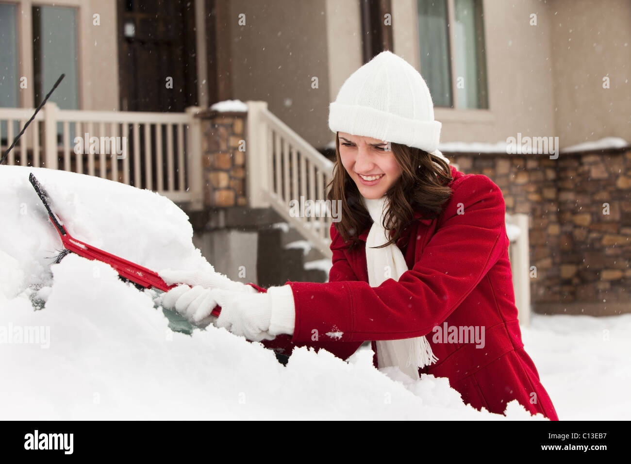 Woman scraping snow from car hi-res stock photography and images - Alamy