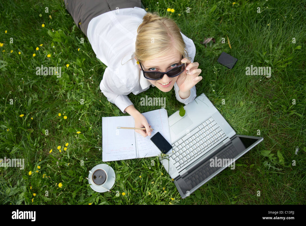 young woman working on computer in the garden Stock Photo - Alamy