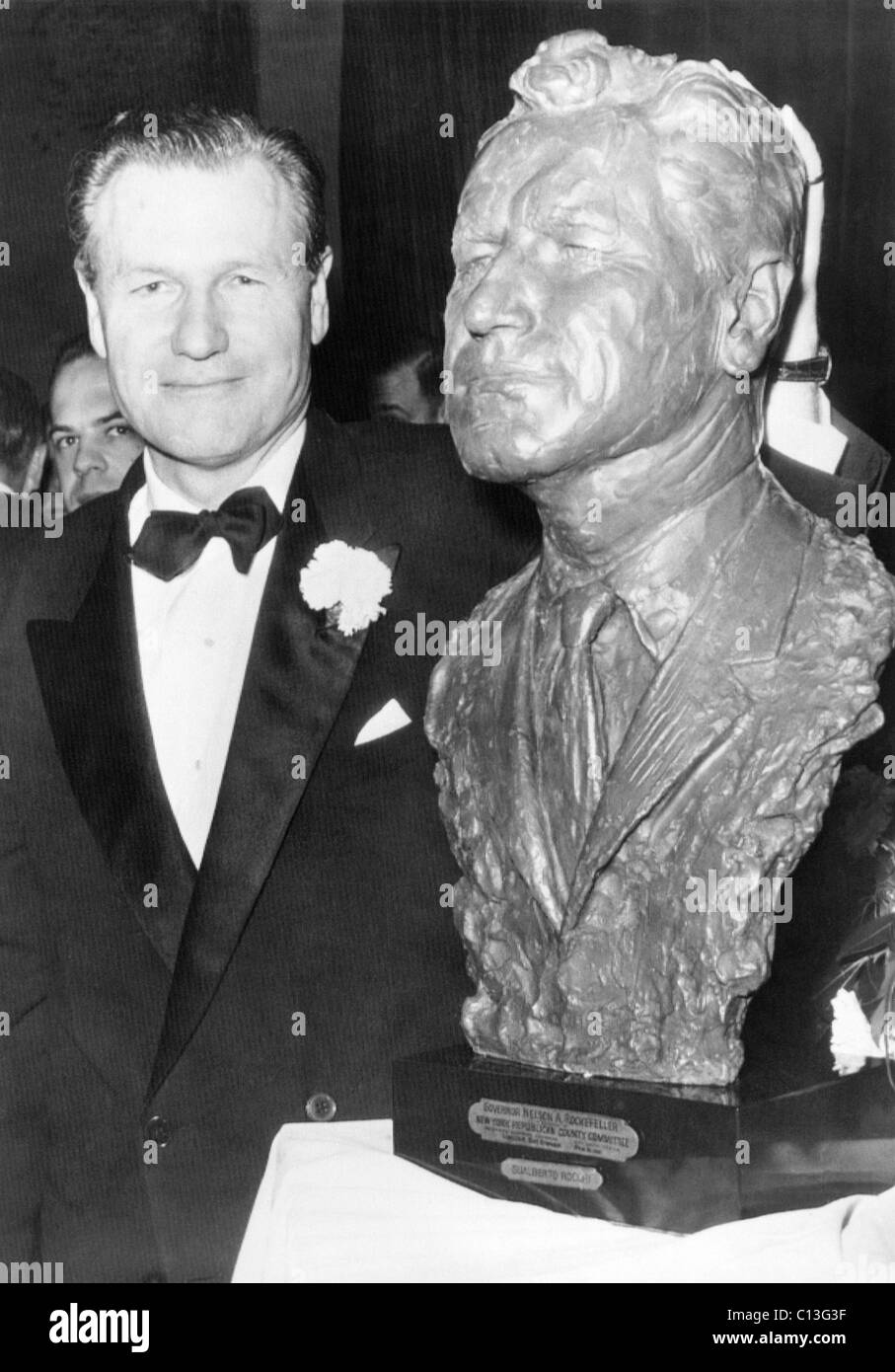 Rockefeller Family. New York Governor Nelson Rockefeller with a bust of ...