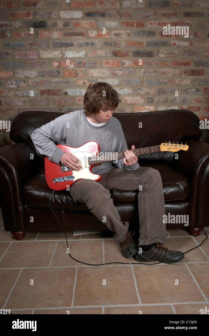 Teenage boy playing vintage electric telecaster fender guitar Stock ...