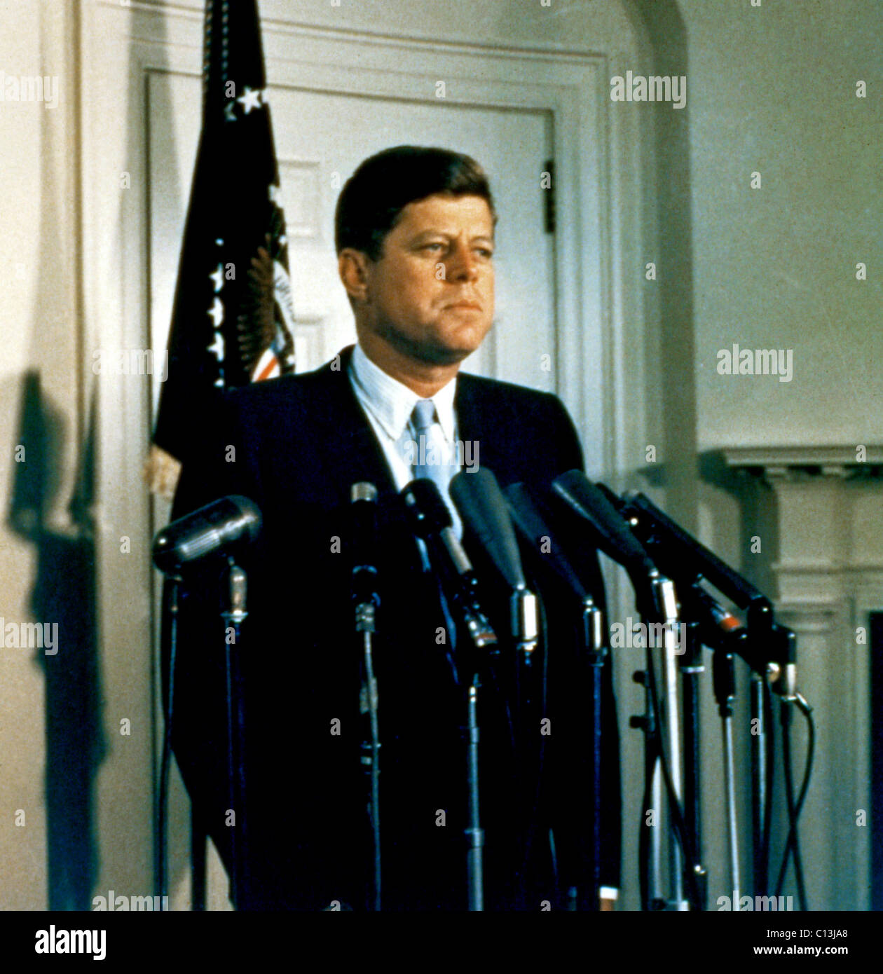 President John F. Kennedy standing at the microphone podium, early ...