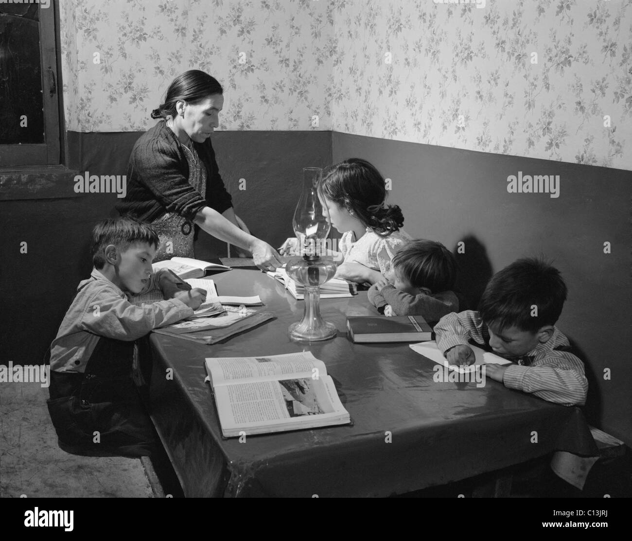 Mrs. Maclovia Lopez, a bilingual Spanish-American mother, supervises ...
