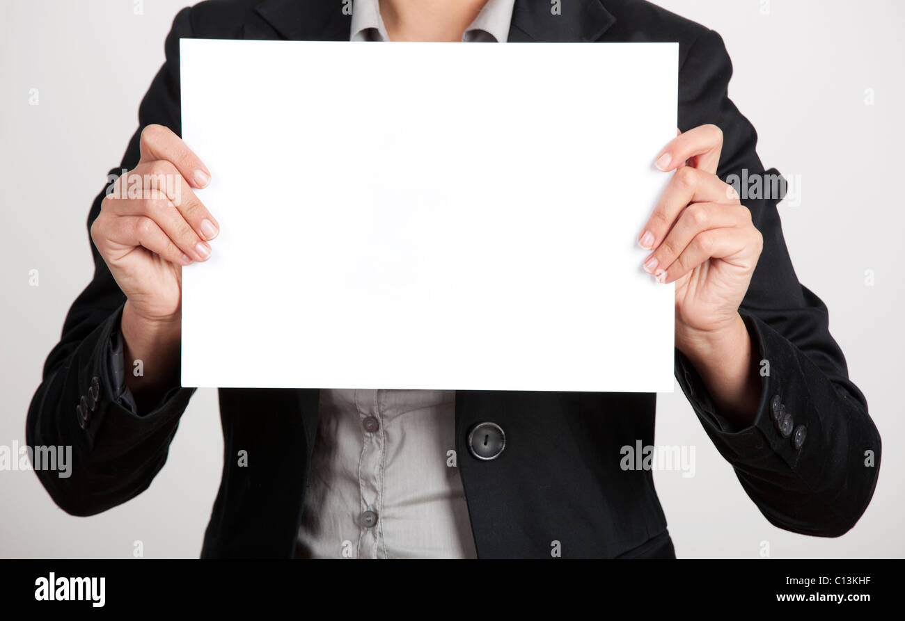 Woman holding a blank paper sheet with both hands Stock Photo - Alamy