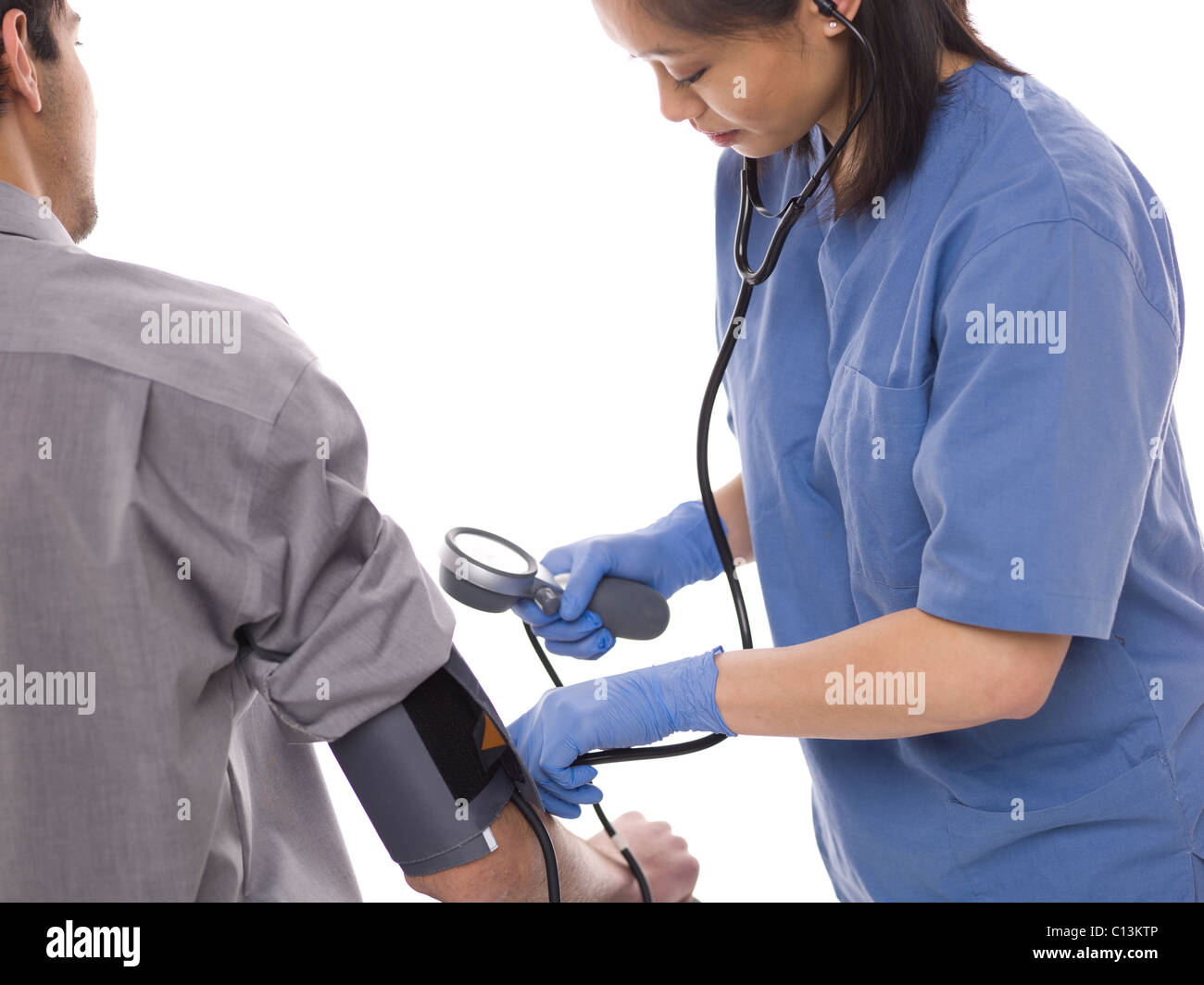 Nurse checking patients blood pressure Stock Photo - Alamy