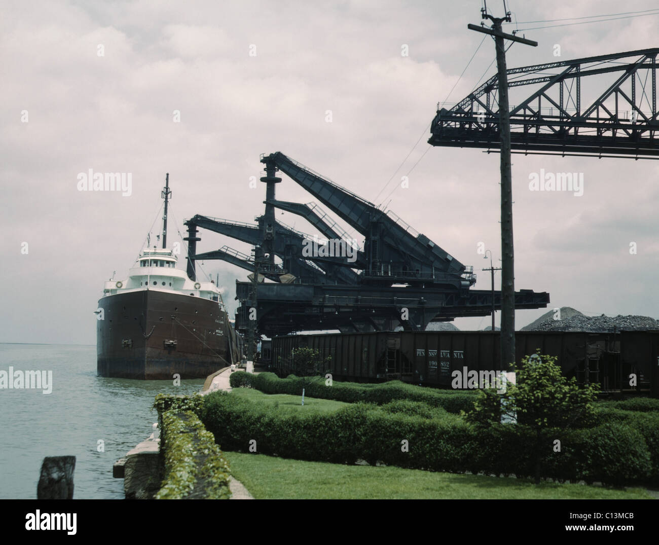 Great Lakes freighter unloading iron ore at the Pennsylvania Railroad ...