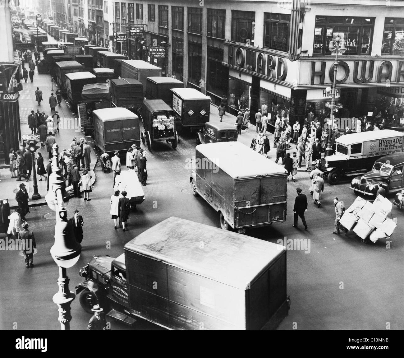 Delivery trucks jamming West 37th Street looking west from 7th Avenue ...