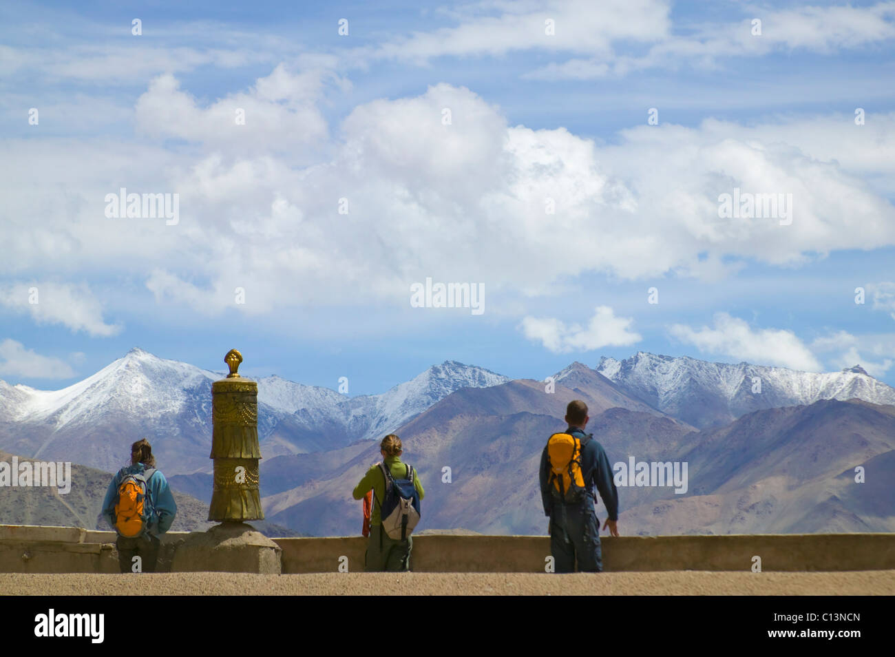 Western travelers watch the Himalayas from Hemis Gompa, Leh, Ladakh ...