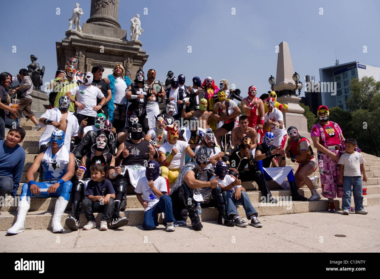 Group of Mexican luchadores (wrestlers) in front of the Angel of ...