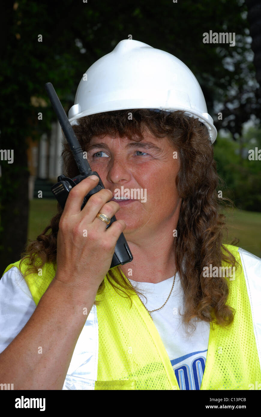 Female Sewer Worker; Yellow Vest; Phone; Communications; Hard Hat ...