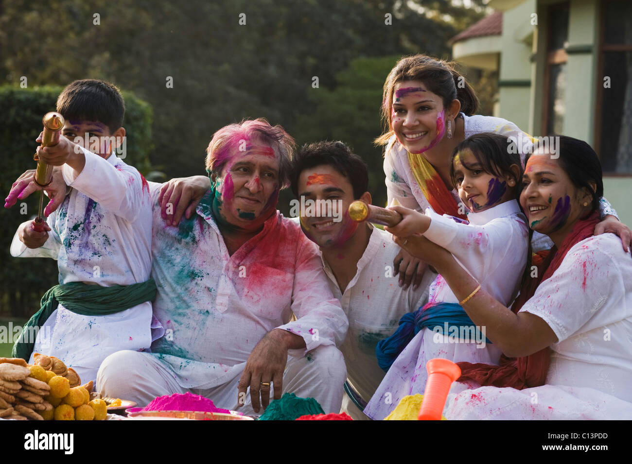 Family celebrating Holi Stock Photo - Alamy