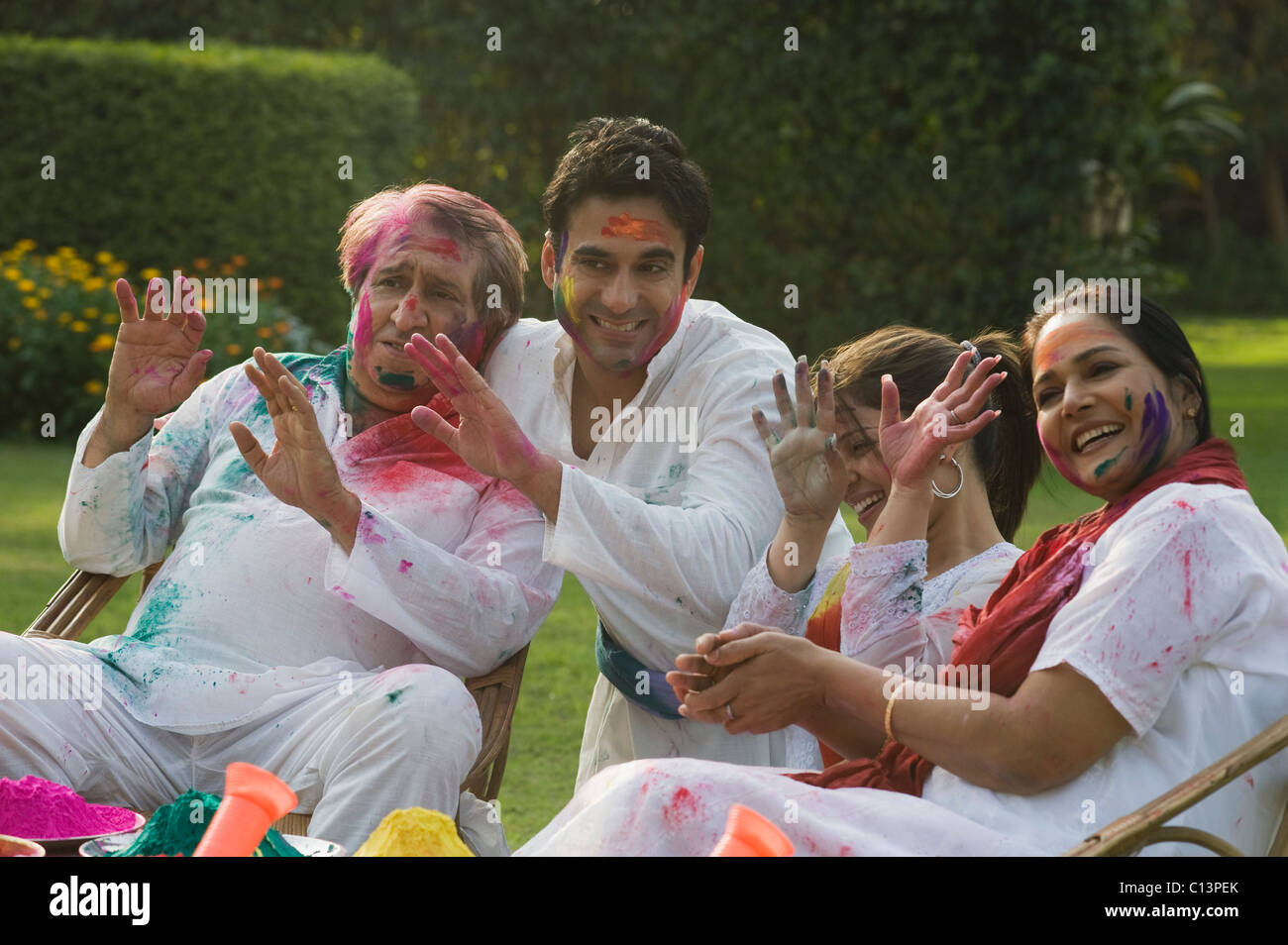 Family celebrating Holi Stock Photo - Alamy