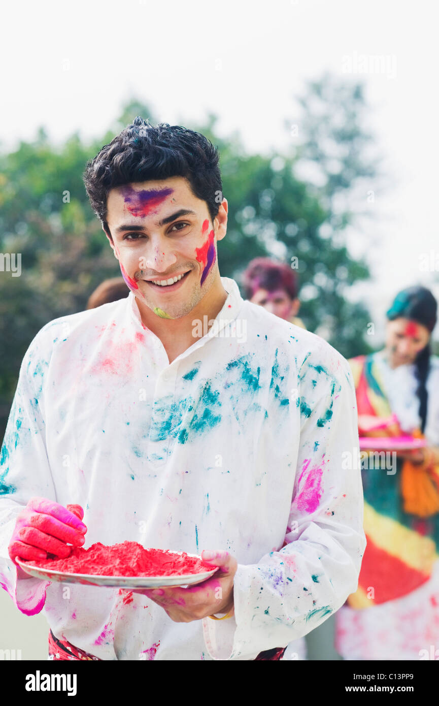 Portrait of a man celebrating Holi Stock Photo - Alamy