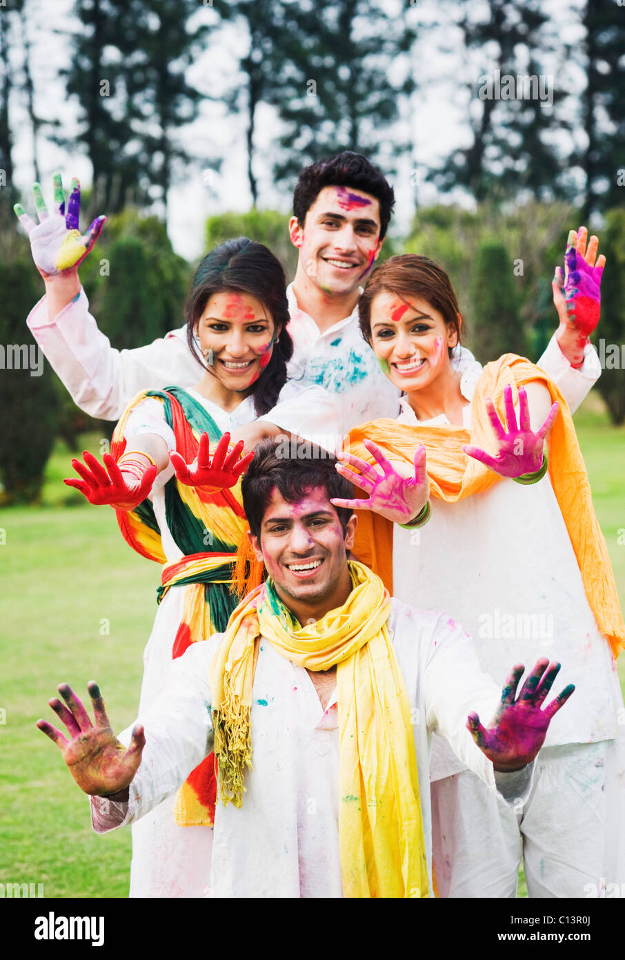 Friends showing their colored hands while celebrating Holi Stock Photo ...