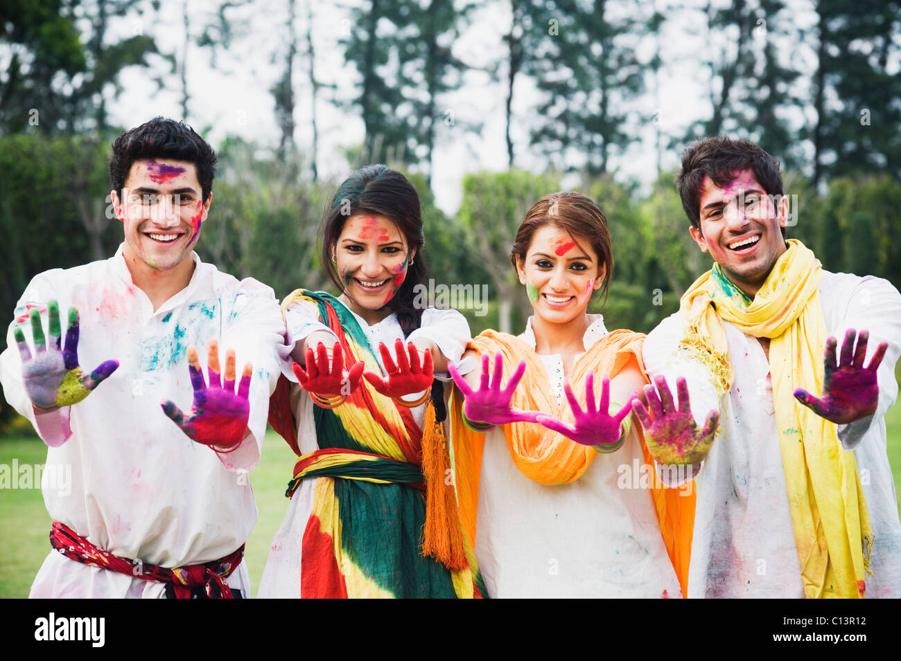 Friends showing their colored hands while celebrating Holi Stock Photo ...