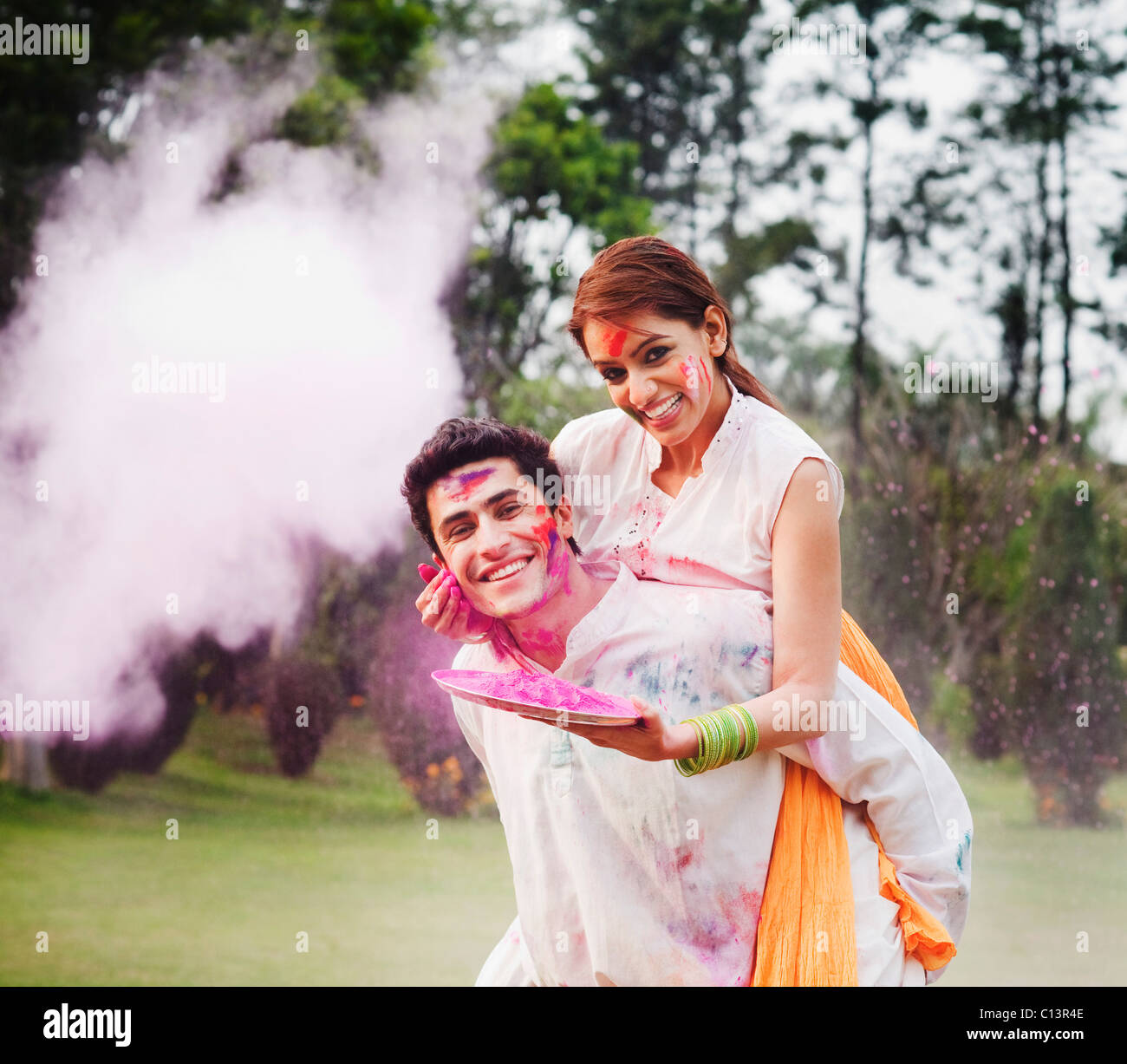 Couple celebrating Holi Stock Photo - Alamy