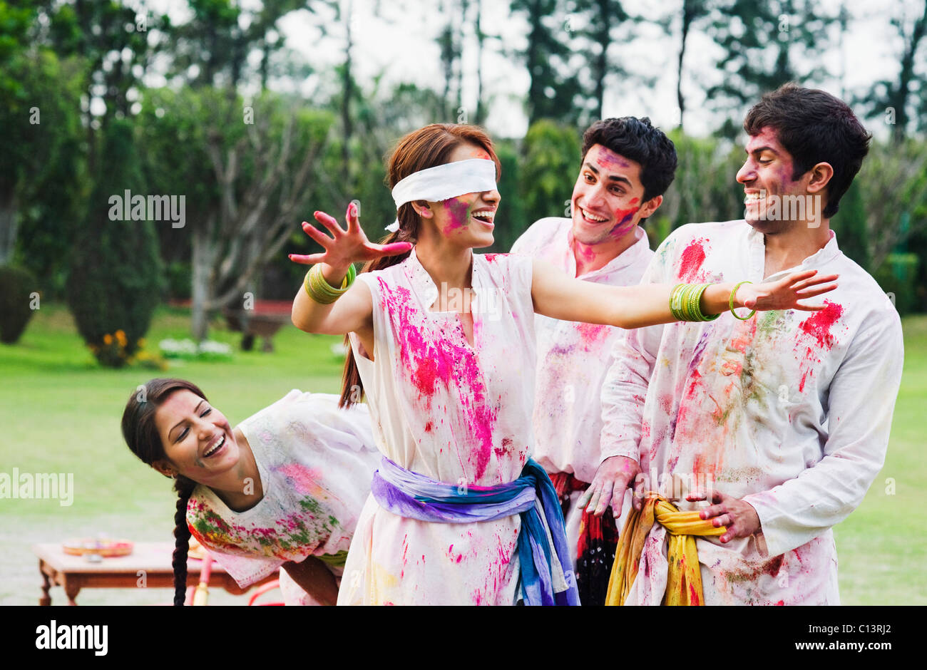 Friends celebrating Holi Stock Photo - Alamy